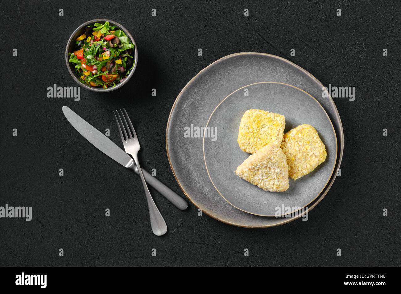 Top view of semifinished squid cutlet in breading Stock Photo - Alamy