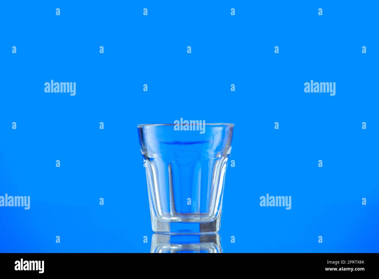 front view water glass on blue background free space Stock Photo - Alamy
