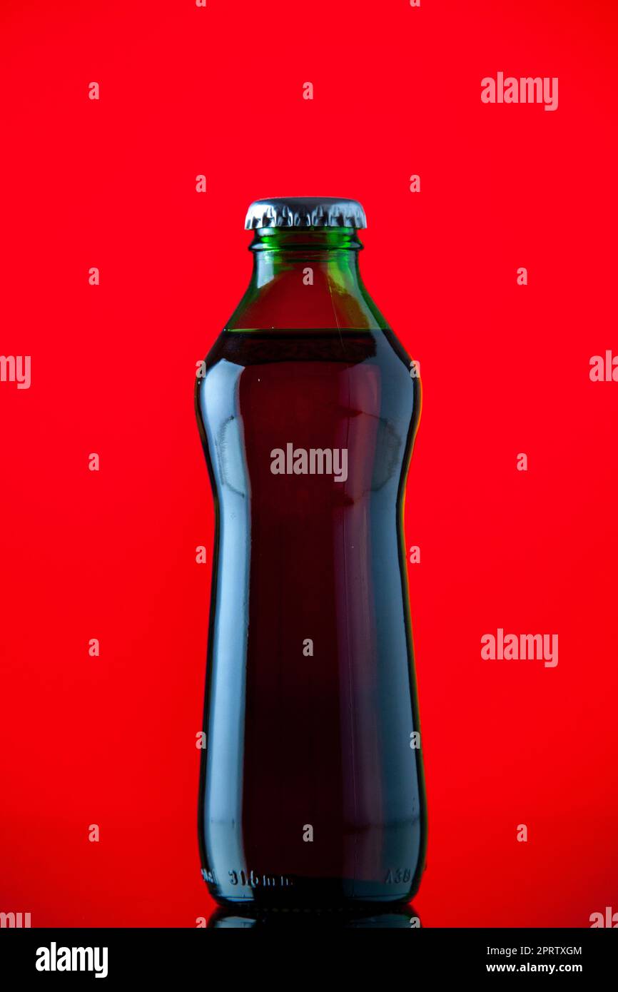 front view soda drink glass bottle on red background stock photo Stock ...