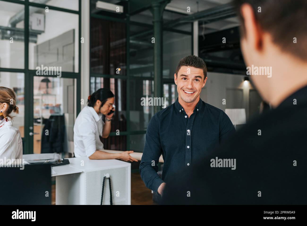 Biracial male colleague hi-res stock photography and images - Alamy