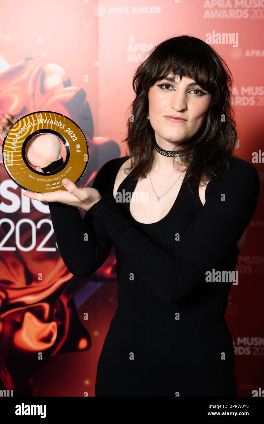 Lucy Blomkamp holds her APRA Award for Most Performed R&B/Soul Work the 2023 APRA Music Awards ...
