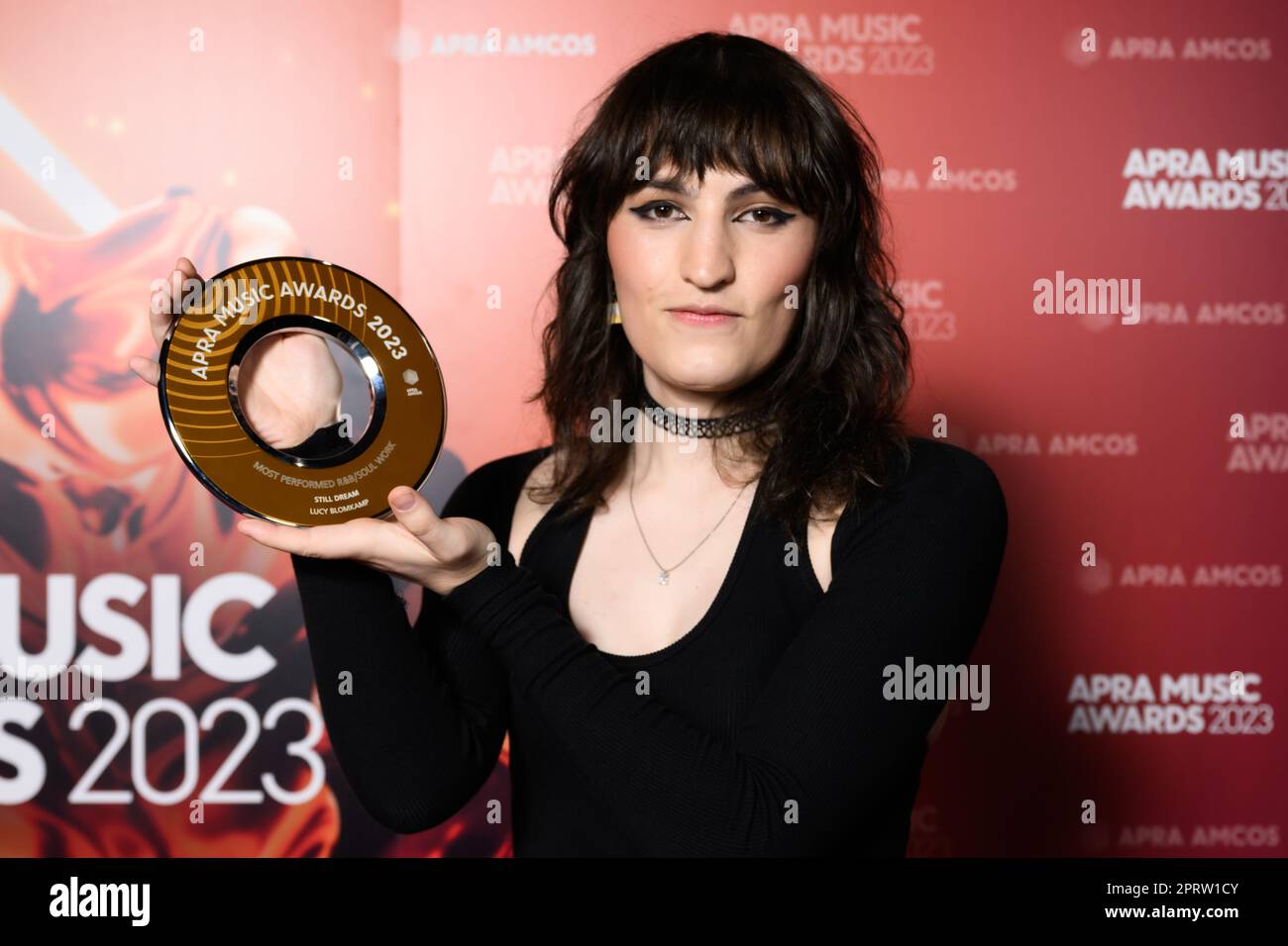 Lucy Blomkamp holds her APRA Award for Most Performed R&B/Soul Work the 2023 APRA Music Awards ...