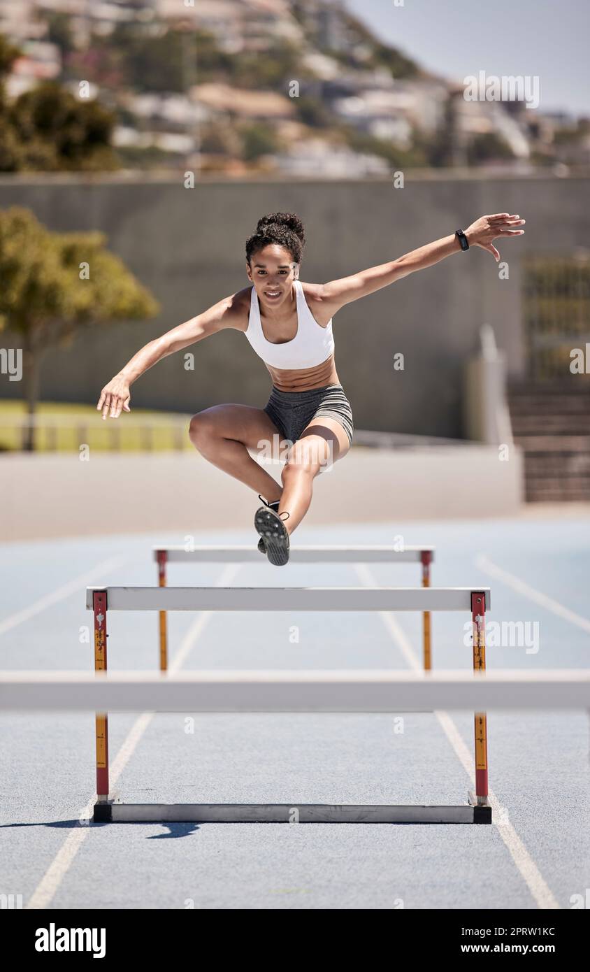 Girl jumping hurdle on running hi-res stock photography and images - Alamy