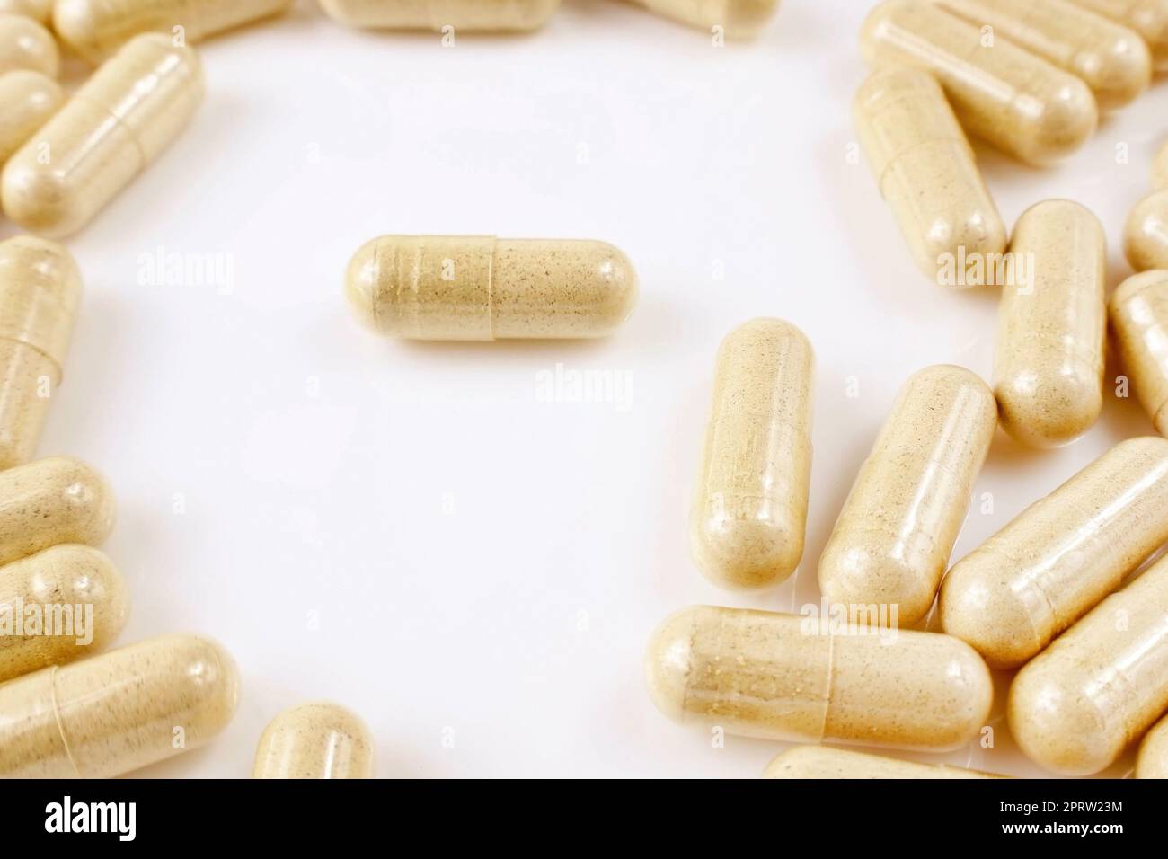 Beige medical capsules with dietary supplements inside close up Stock ...