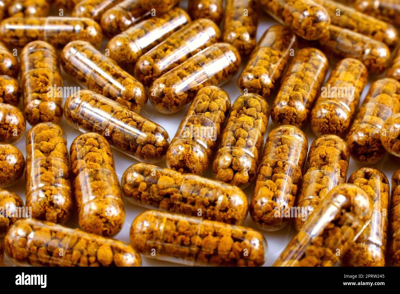 Nutritional supplement capsules with bee pollen inside close up Stock ...