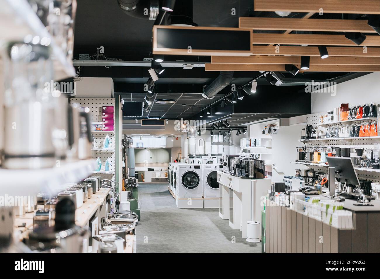Interior of electronics store with various appliances arranged for sale ...
