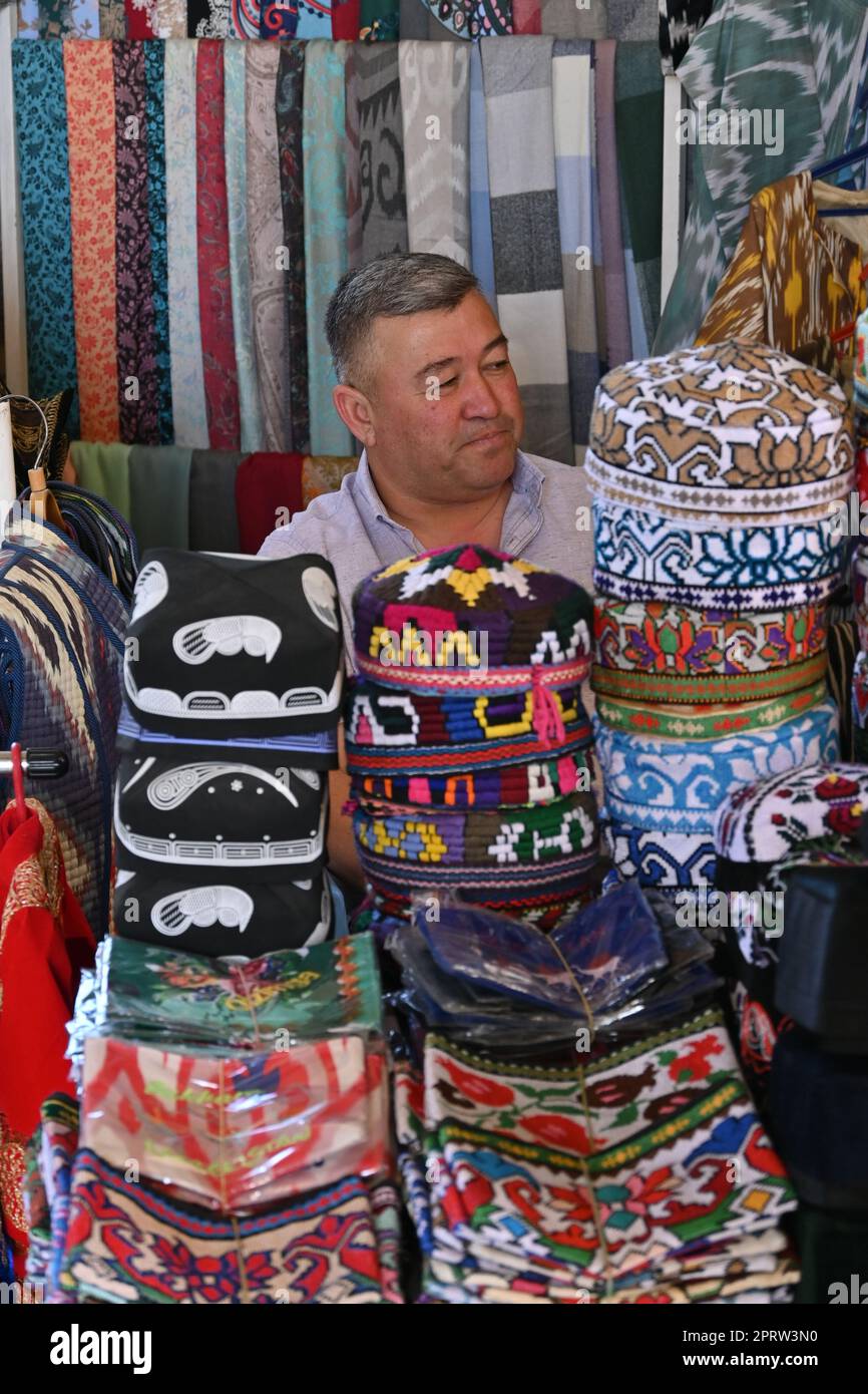 Hat vendor in his market stall in Bukhara, Uzbekistan Stock Photo - Alamy