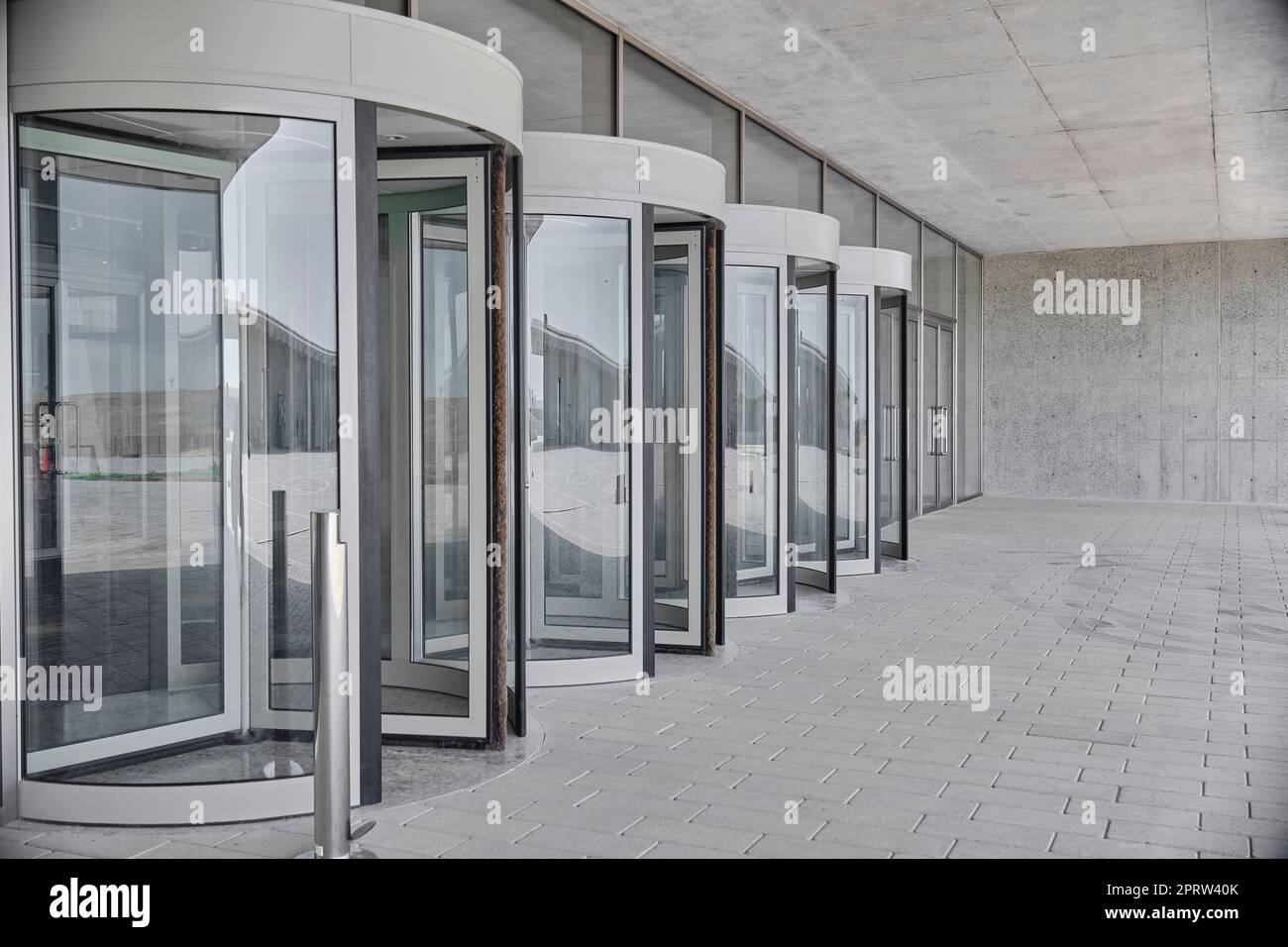 Revolving doors. The facade of a modern shopping center or station, an ...