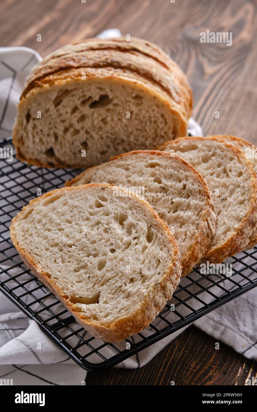 Closeup view of artisan whole grain wheat bread cut on slices on ...