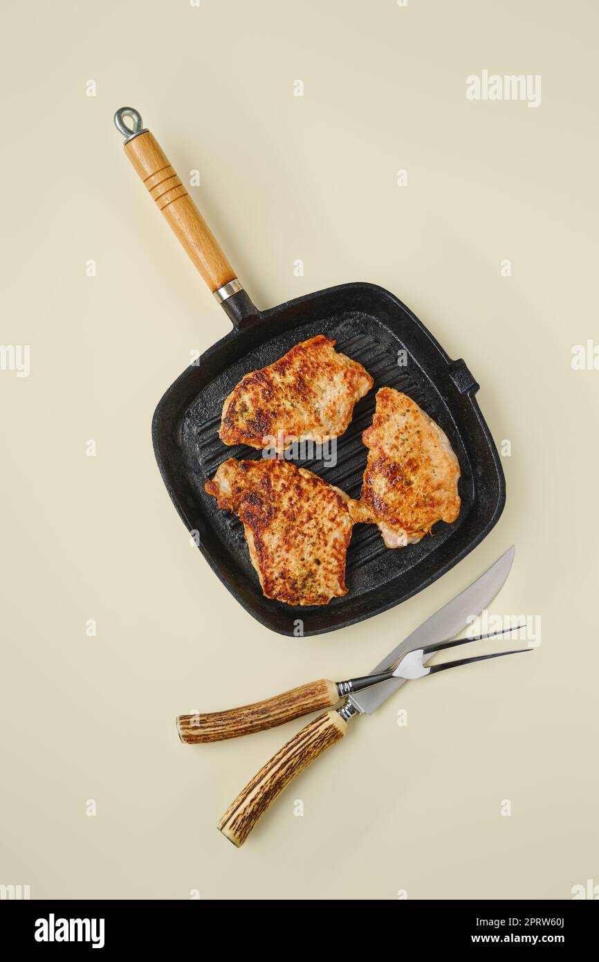 Top view of fried chopped pork tenderloin on frying pan Stock Photo - Alamy