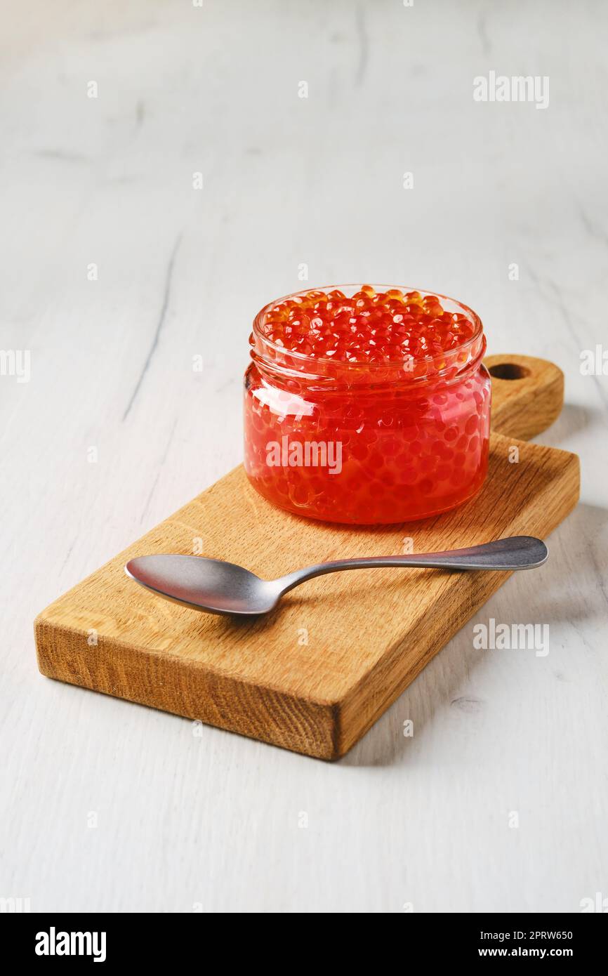 Open bowl with salmon red caviar Stock Photo - Alamy