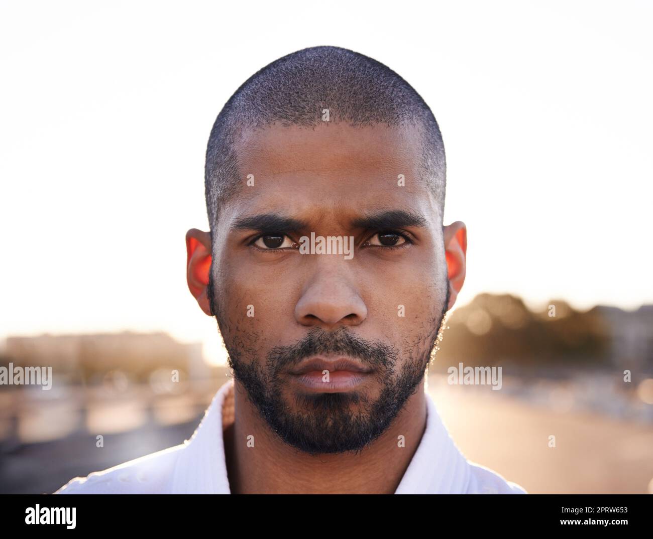 Serious man standing outdoors hi-res stock photography and images - Alamy