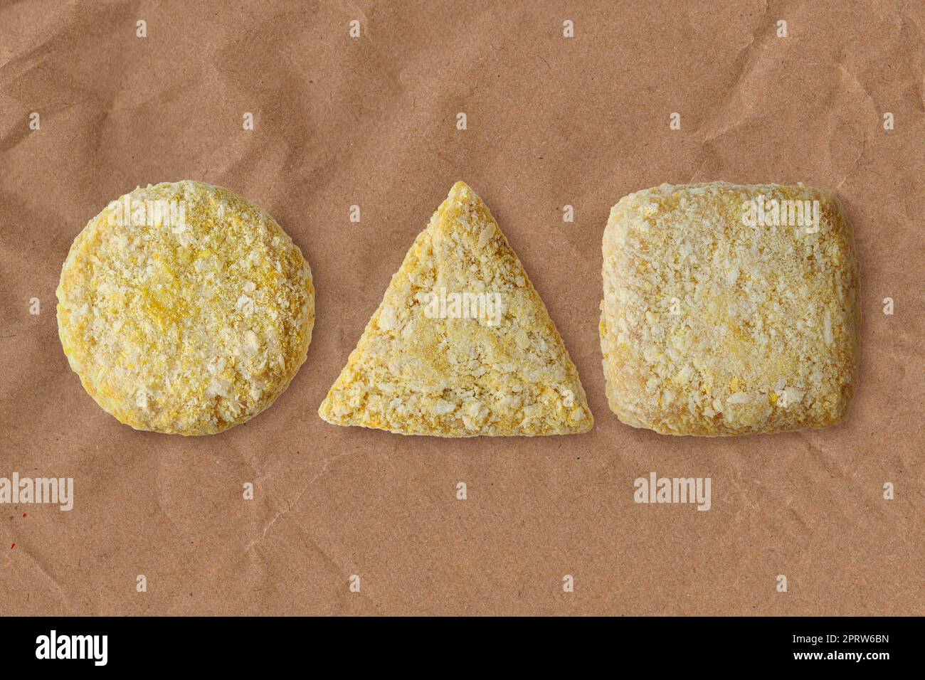 Round, triangular and square squid cutlet Stock Photo - Alamy