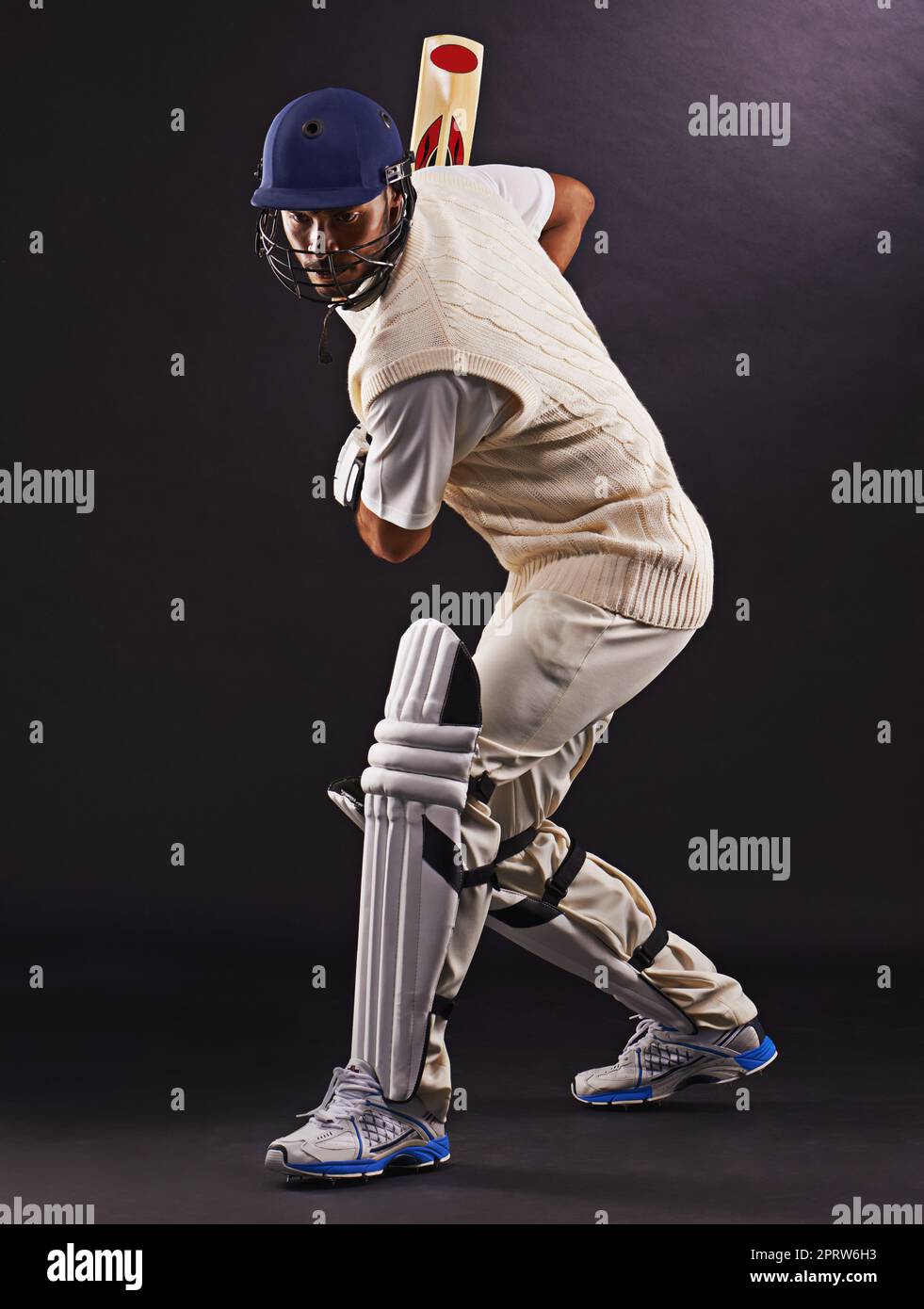 The perfect strike. A cropped shot of an ethnic young man in cricket ...