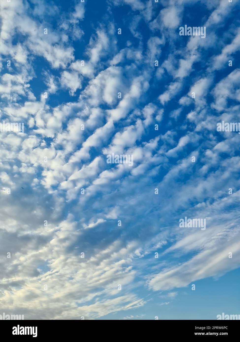Beautiful fluffy white cloud formations in a deep blue summer sky Stock ...