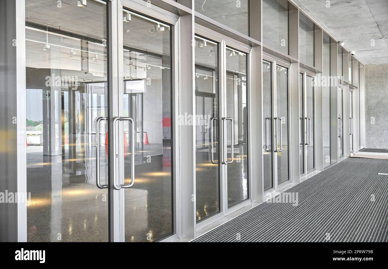 Revolving doors. The facade of a modern shopping center or station, an ...