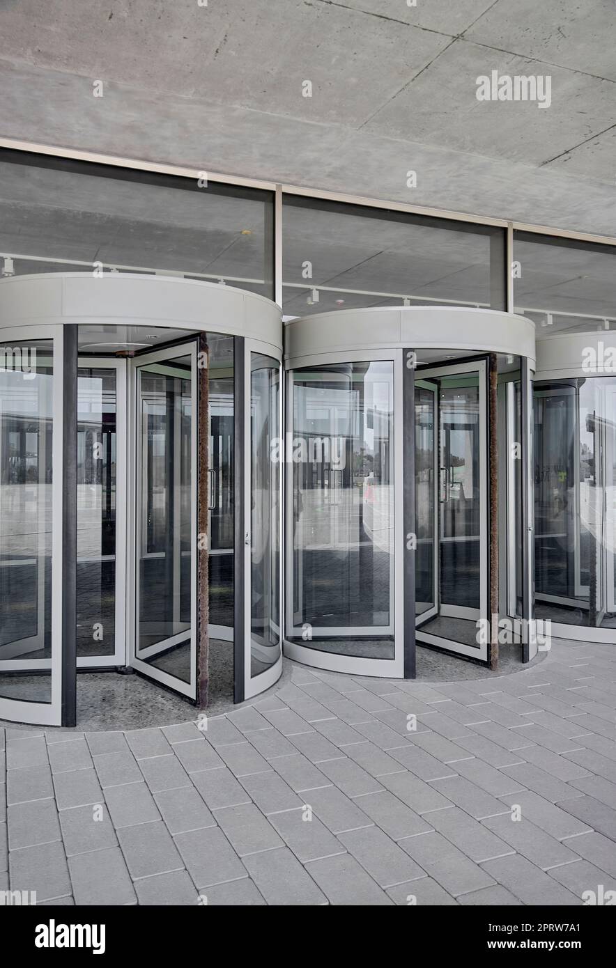 Revolving doors. The facade of a modern shopping center or station, an ...
