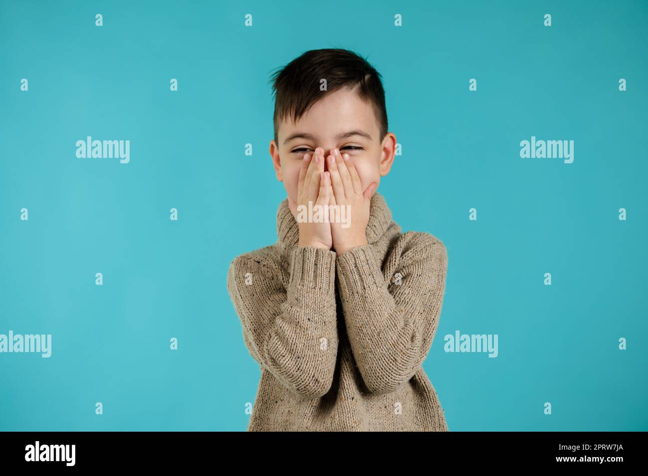 sad little child boy on blue background. Human emotions and facial ...