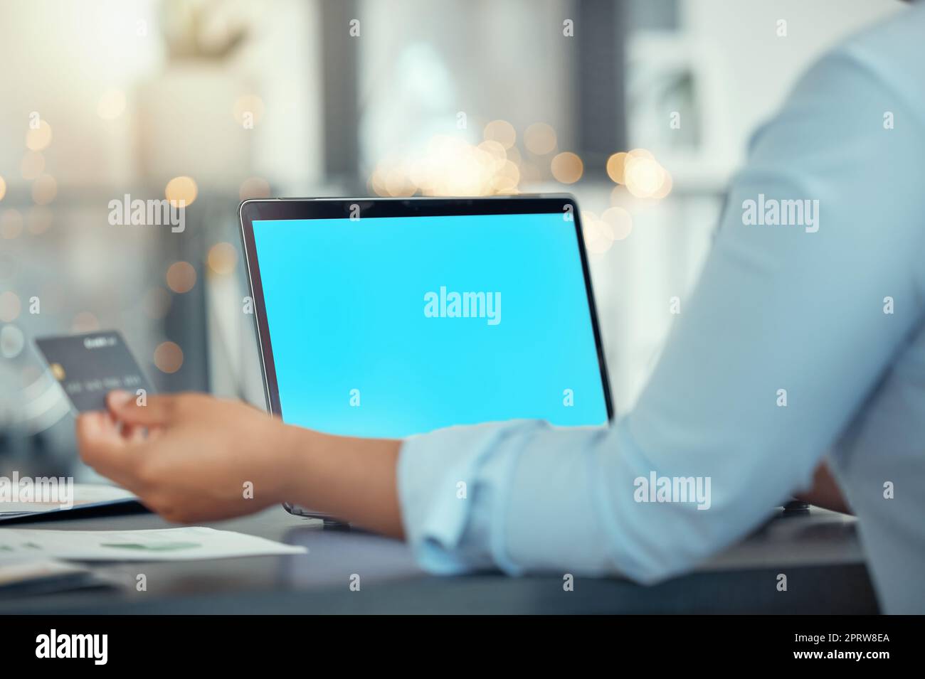 Hands, business woman with a credit card and laptop with blue screen in ...