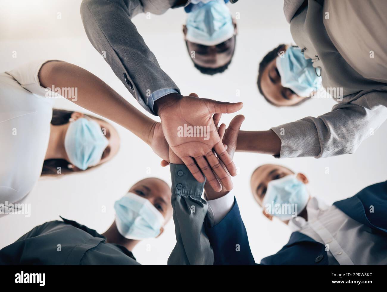 Covid, team and hands in for support and teamwork motivation of office ...