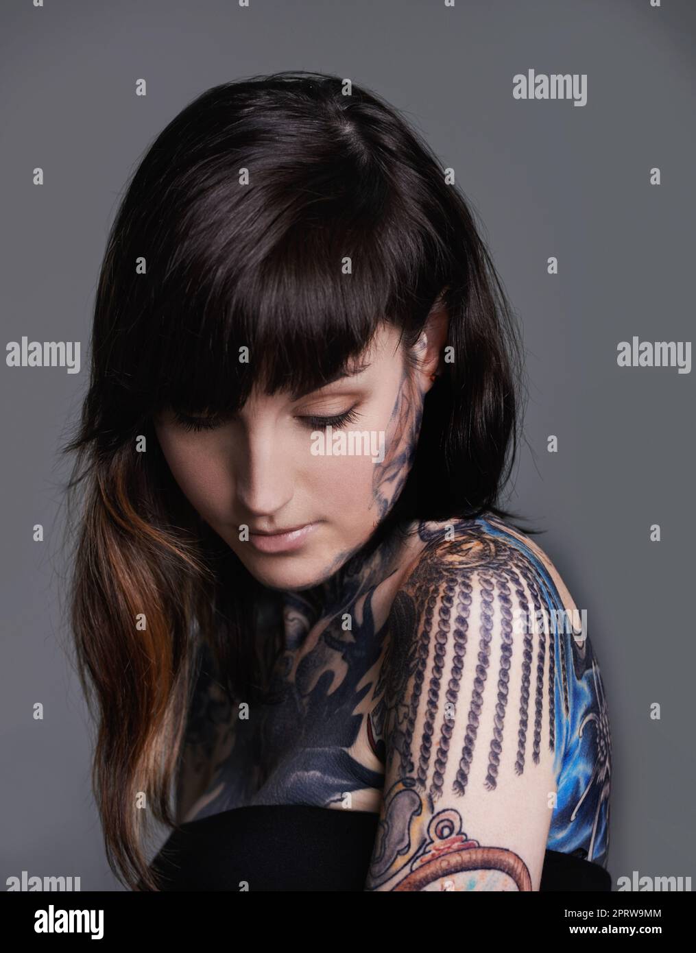 Alternative beauty. A cropped studio shot of a beautiful young tattooed ...