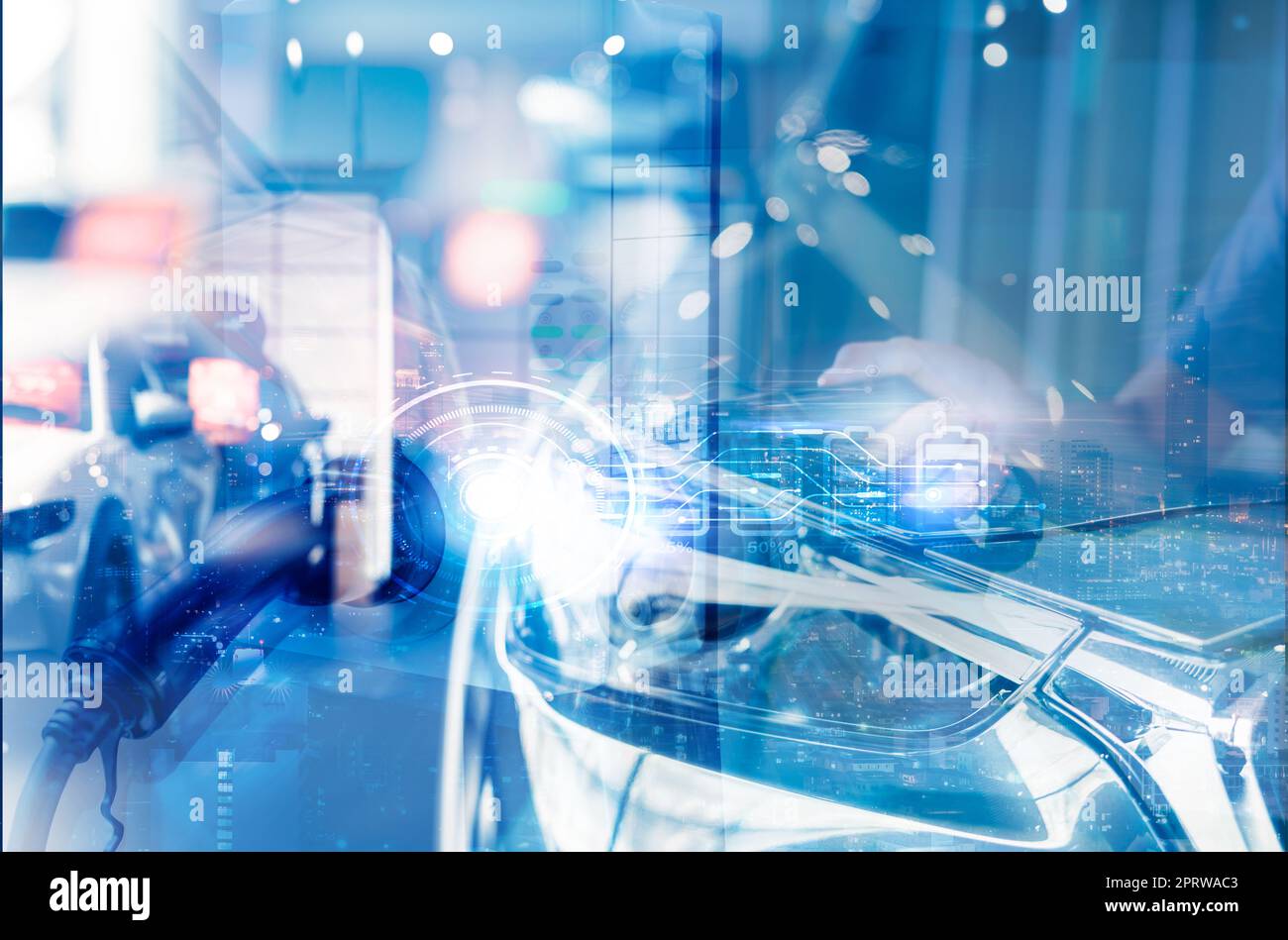 Car charging at electric car charging station and city night lights ...