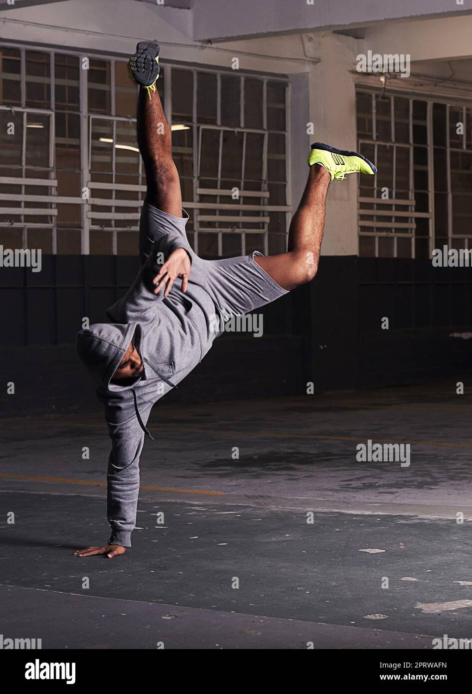 Strength and form. A full length shot of a young man breakdancing Stock ...