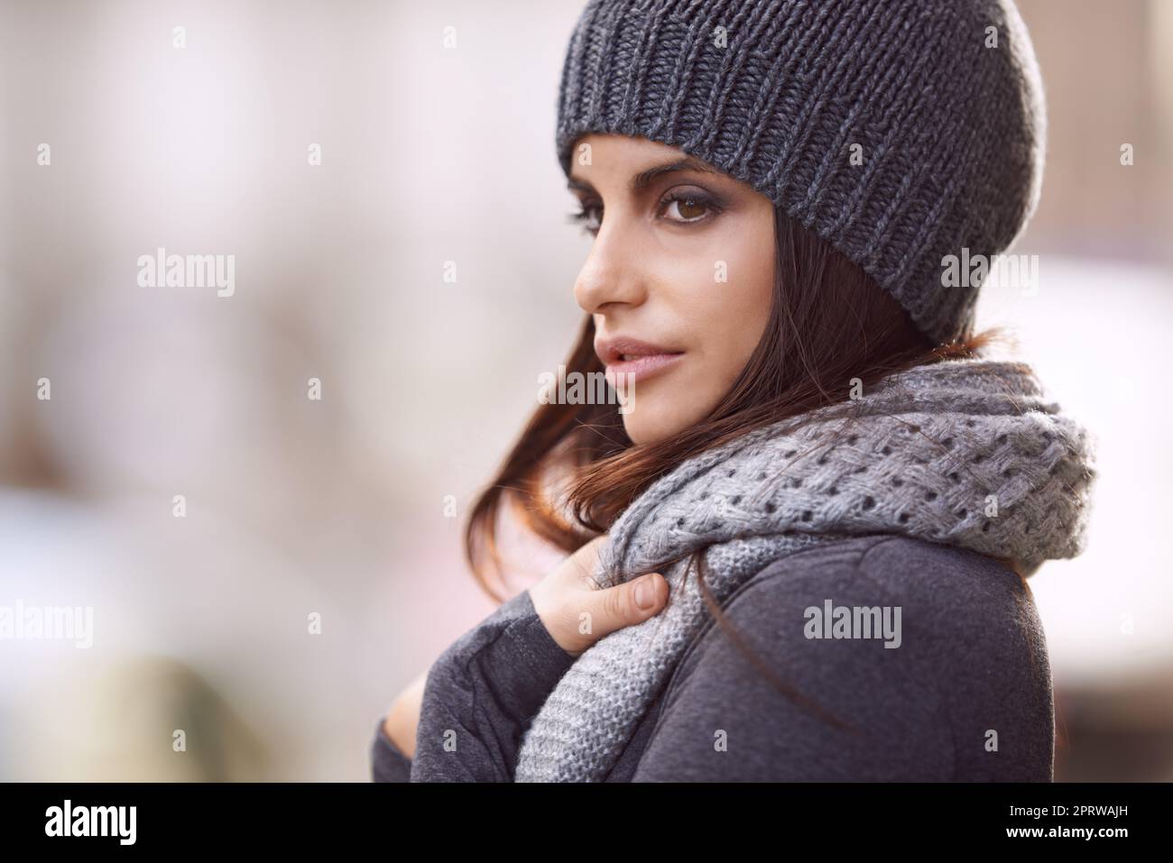 Hello winter. a beautiful young woman wearing stylish winter clothing ...
