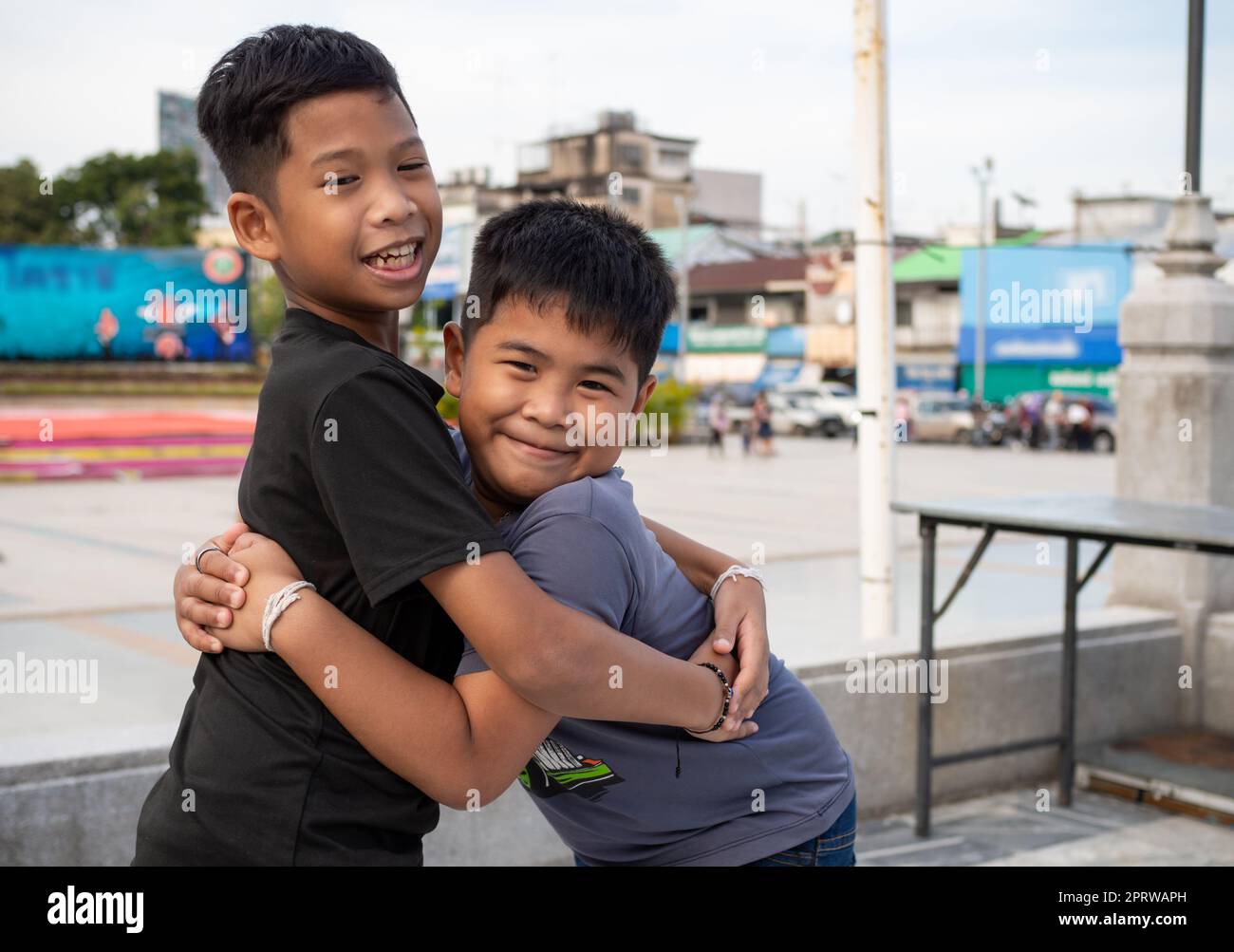 Two brothers hugging each other hi-res stock photography and images - Alamy