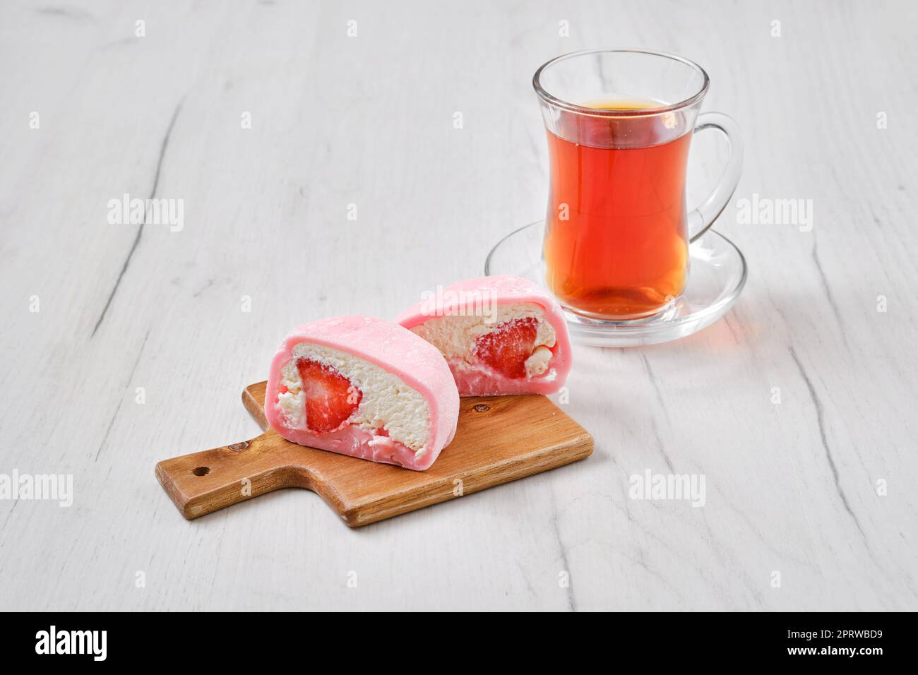 Sweet dessert mochi with strawberry cut on half Stock Photo - Alamy