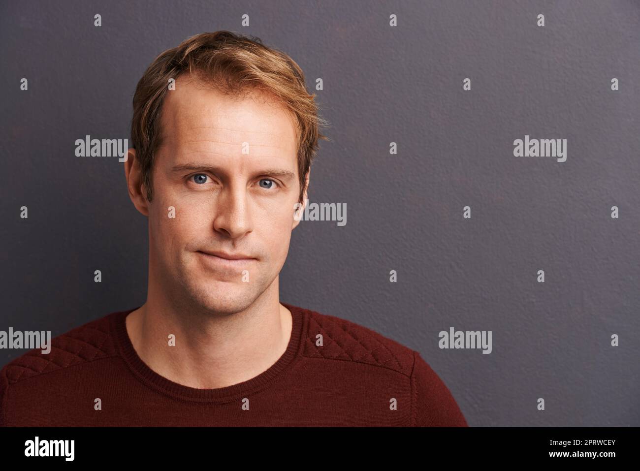 Keeping it casual. Portrait of a handsome young man in a studio in ...