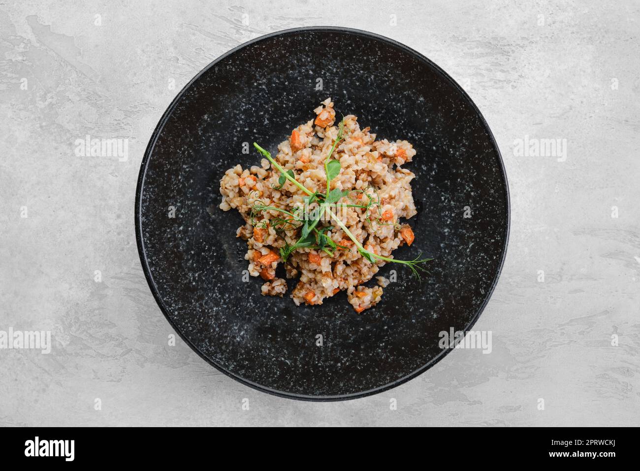 Garnish to the main dish - buckwheat porridge with slices of fried ...
