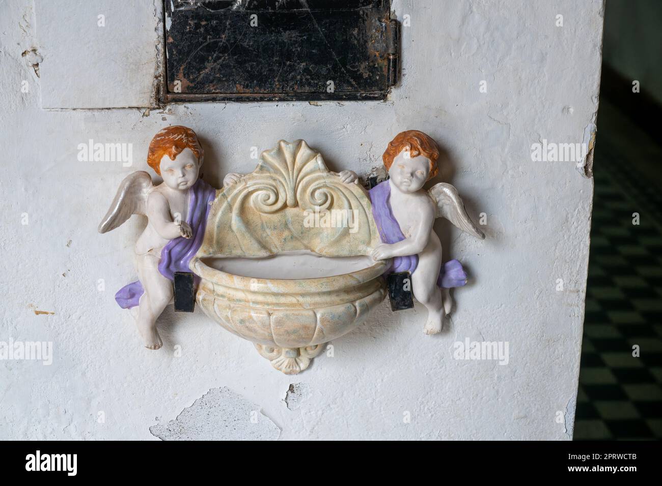 A holy water font or stoup in the historic Nuestra Señora del Carmen ...
