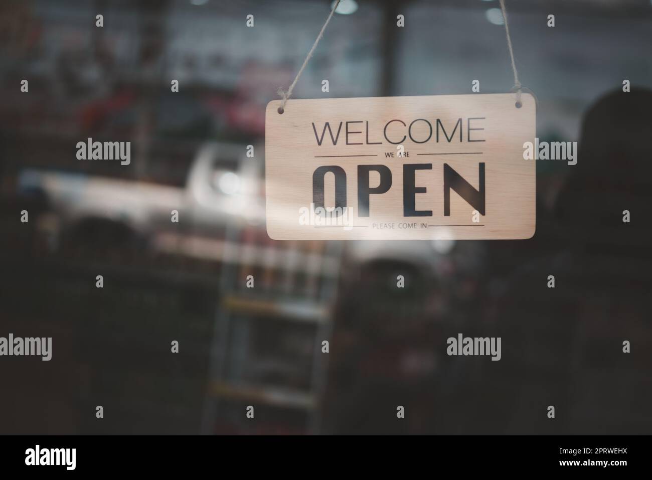 Shop opening sign at the glass door in vintage tones Stock Photo - Alamy