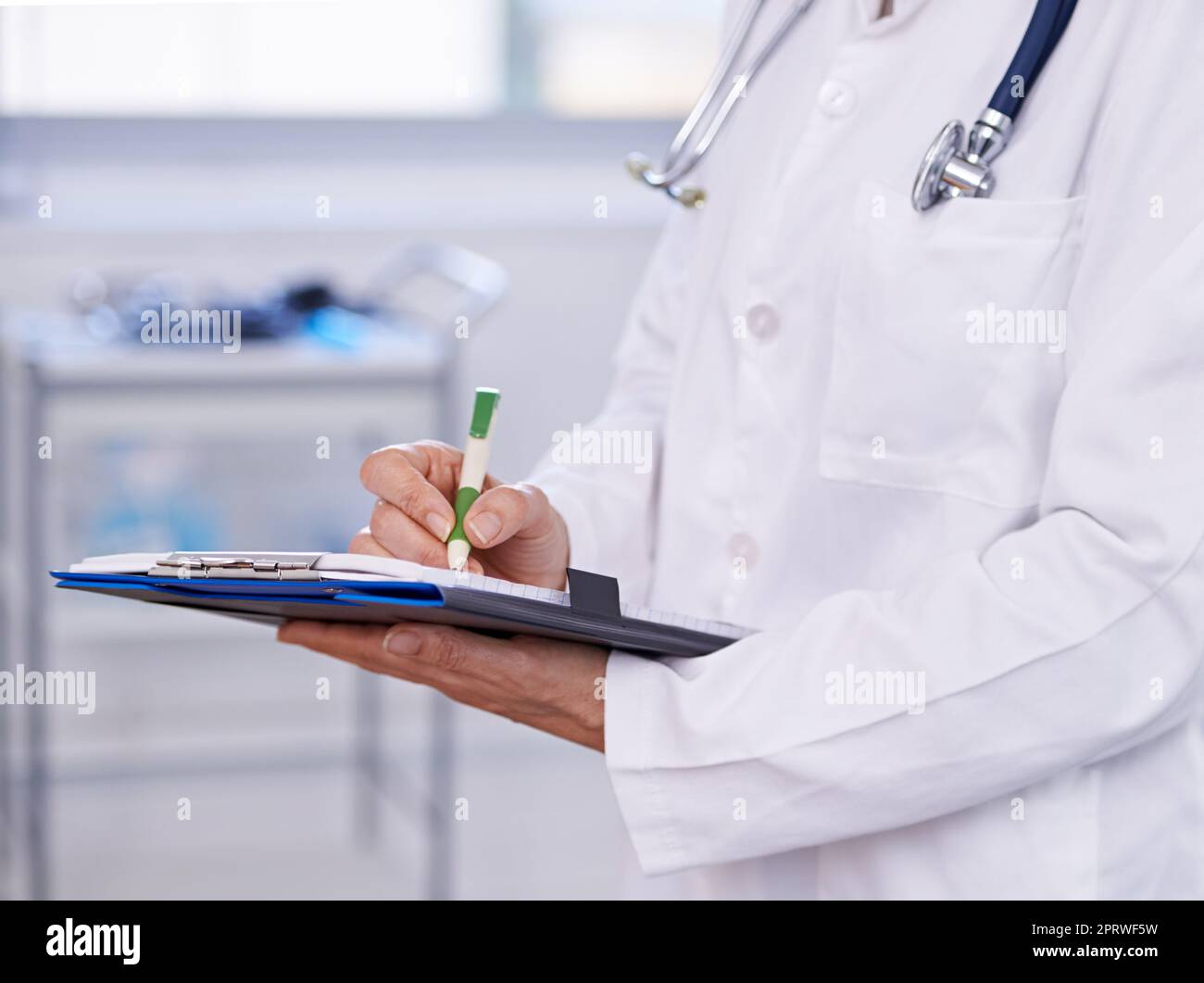 Taking notes help discover symptoms. an unrecognizable doctor making ...