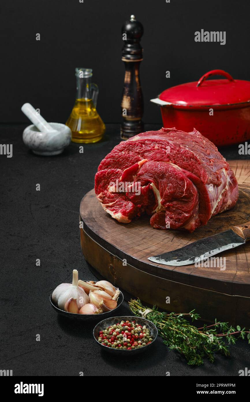 Raw beef neck on wooden stump Stock Photo - Alamy