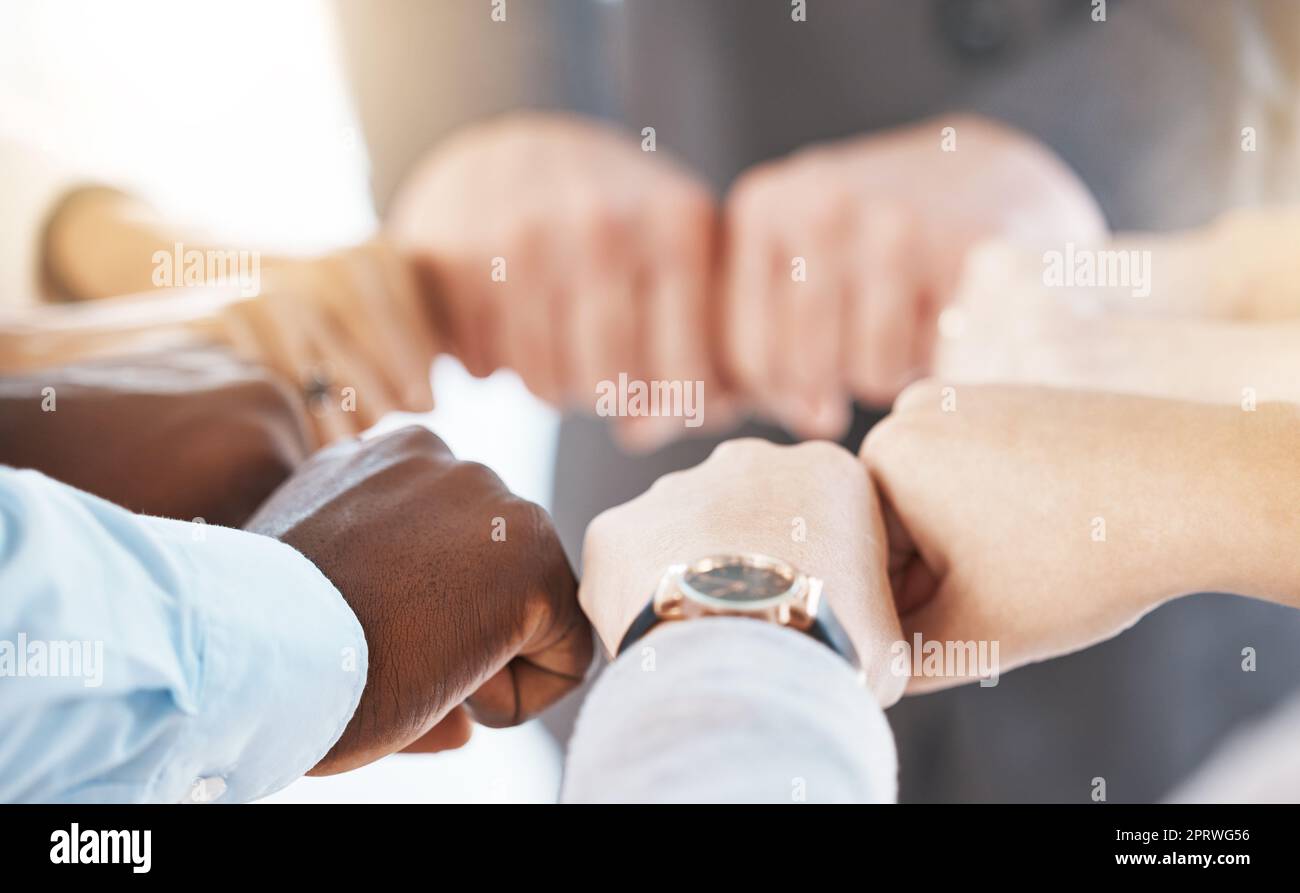 Diversity business hands fist bump for teamwork, collaboration or solidarity in corporate ...