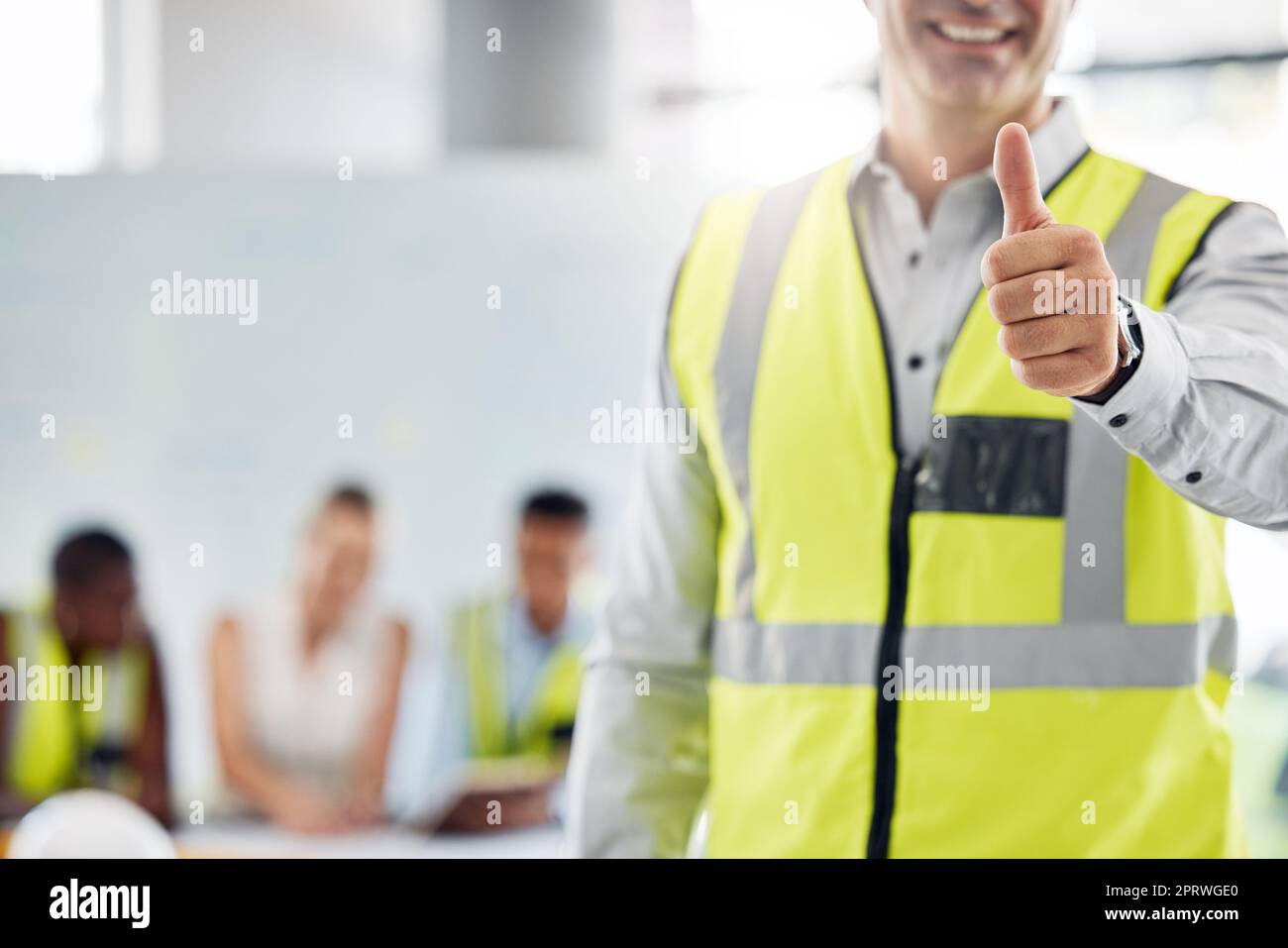 Thumbs up, success and happy architect man standing against a blurred ...