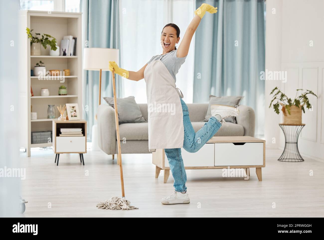 Fun Asian Woman Mop Or Cleaning Living Room With Housekeeping Floor