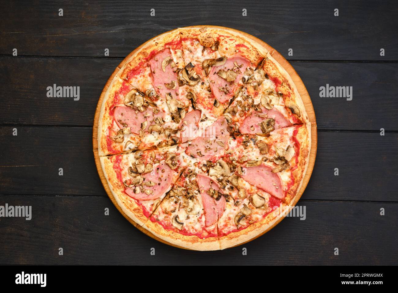 Pizza with beef ham, mushrooms and tomato Stock Photo - Alamy