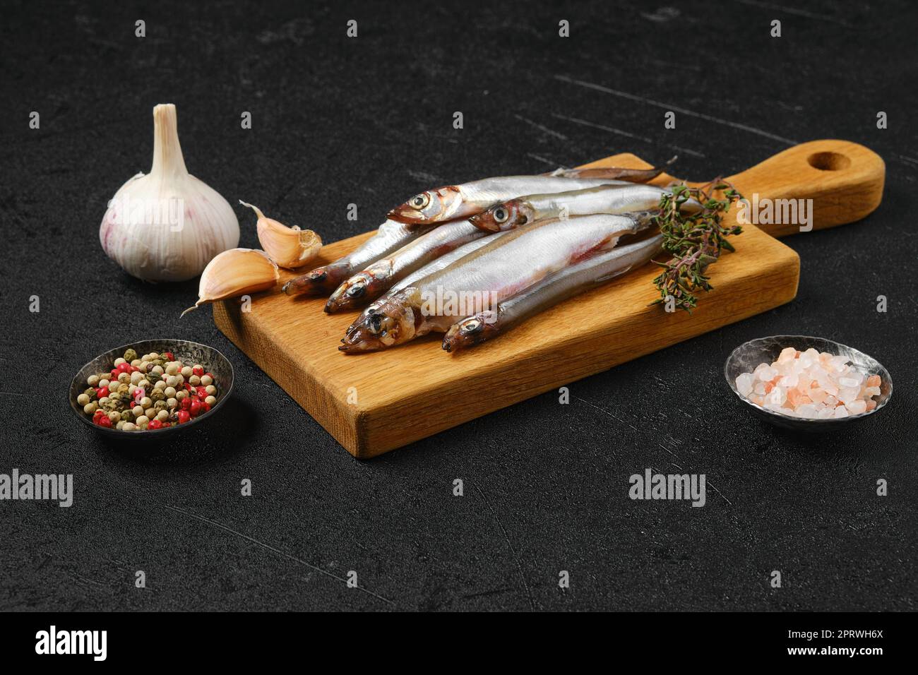 Fresh raw frozen capelin Stock Photo - Alamy