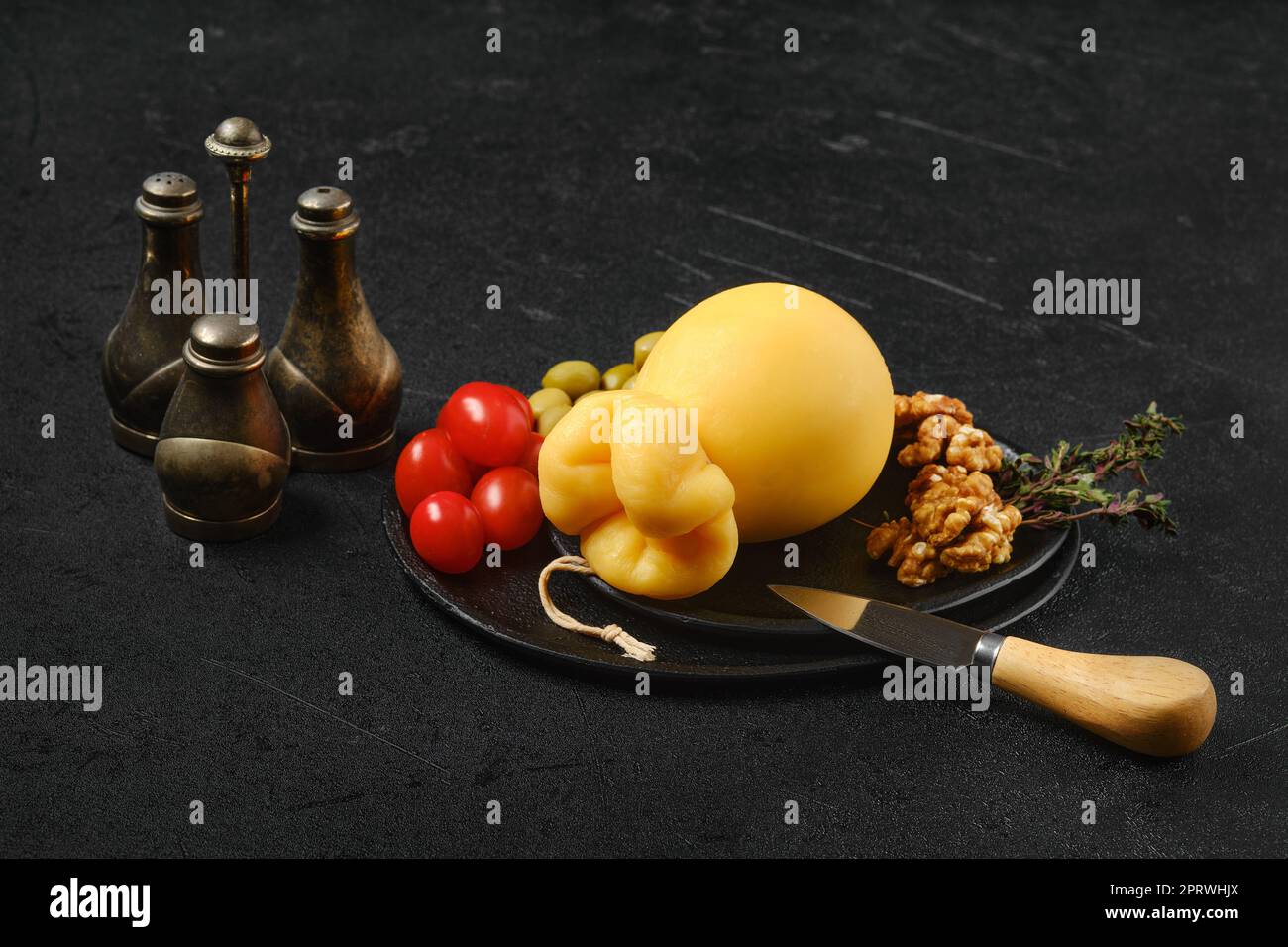 Classic italian caciocavallo cheese on a plate Stock Photo - Alamy