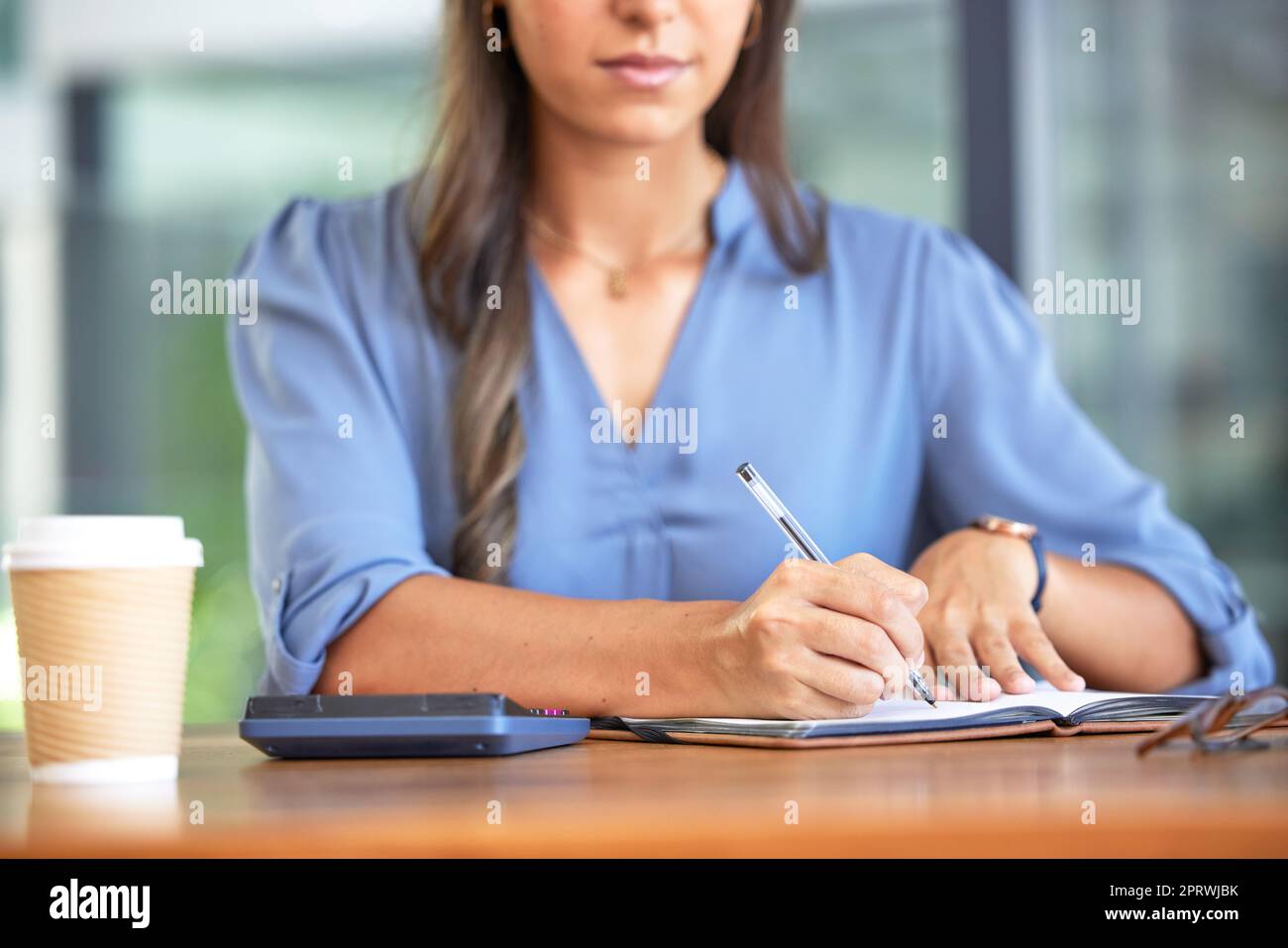 Business woman, accountant and notebook while writing notes and using ...
