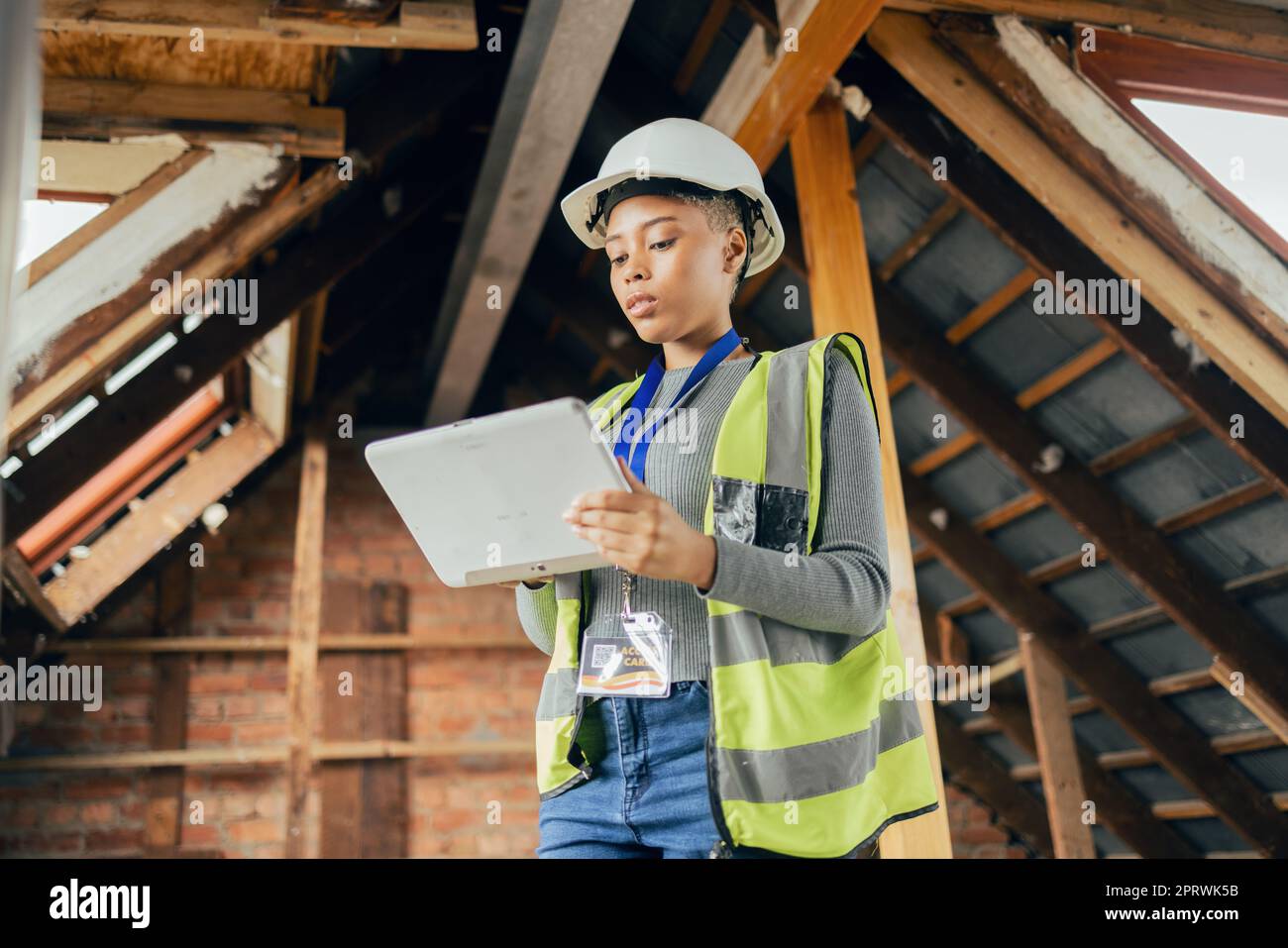 Tablet, woman construction worker or engineer with tech in construction ...