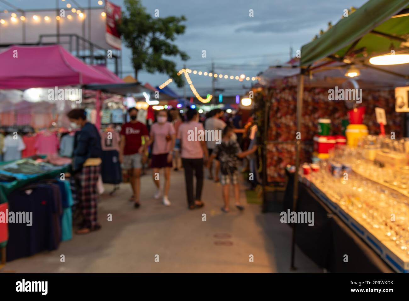 blurred image of night market festival people walking on road with ...