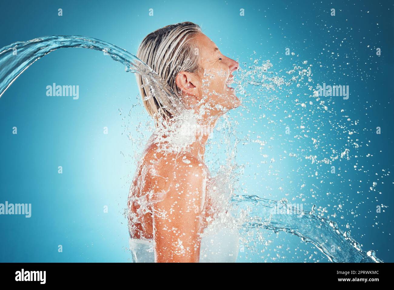 Water splash, laughing and model woman happy about wellness, water and skin beauty. Happiness of ...