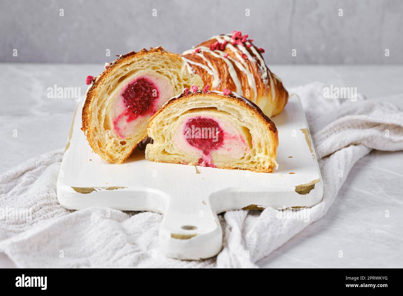 Croissant cut in half, showing the cross section with raspberry ...