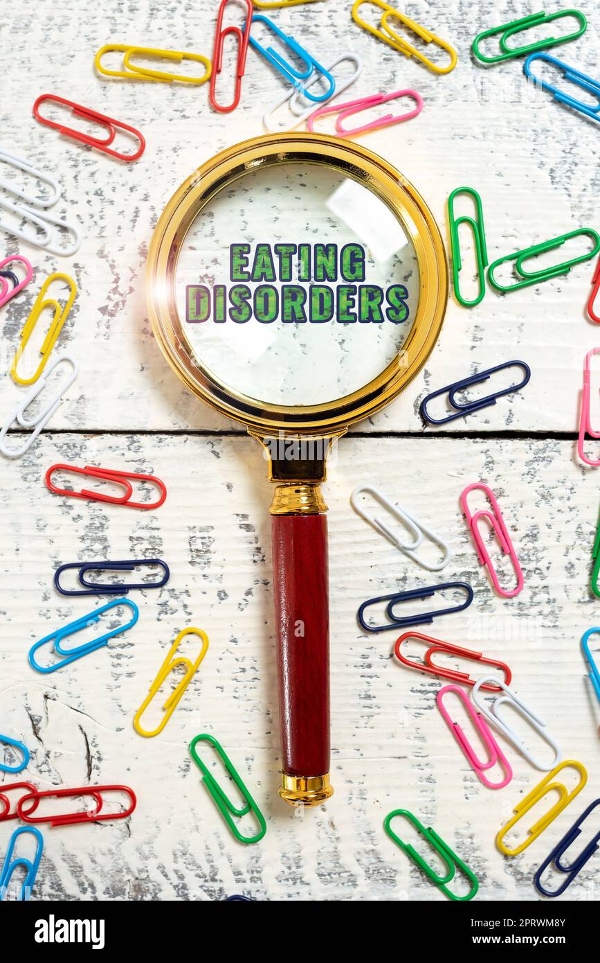 Hand writing sign Eating Disordersany of a range of psychological ...