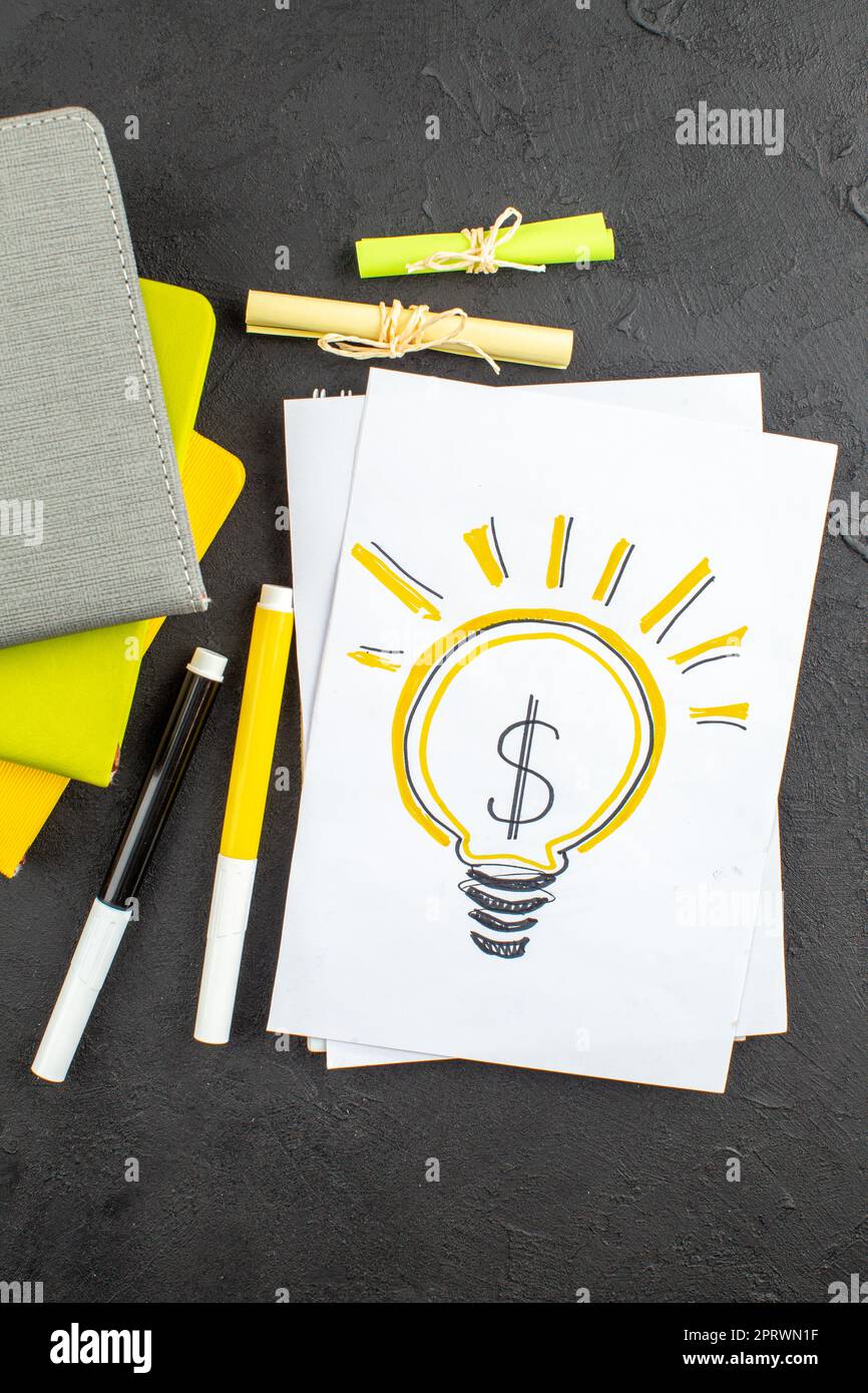 top view colorful notepads yellow and black markers idealight bulb ...