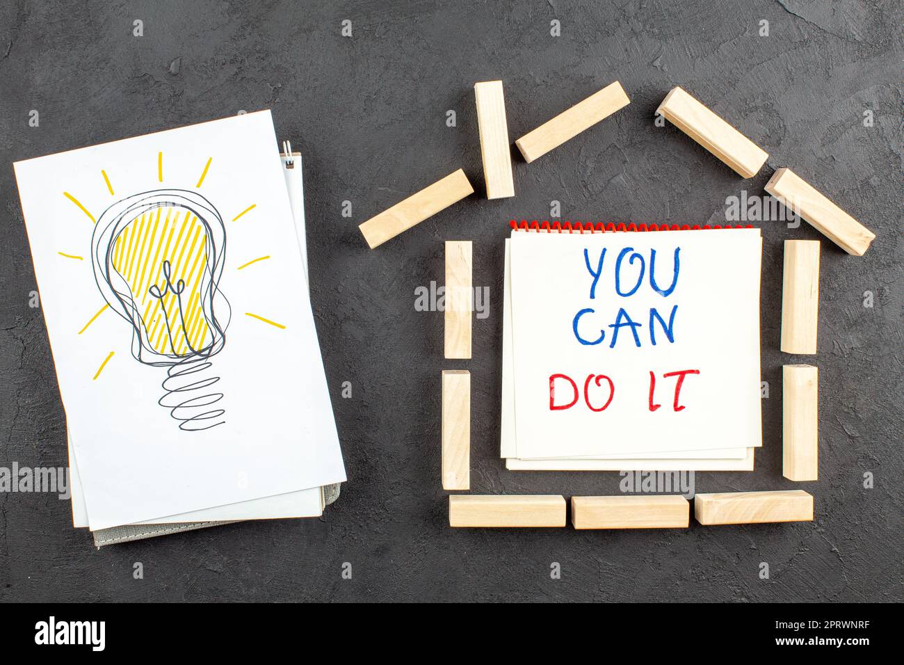 top view idealight bulb drawing on paper house shaped wood blocks you ...